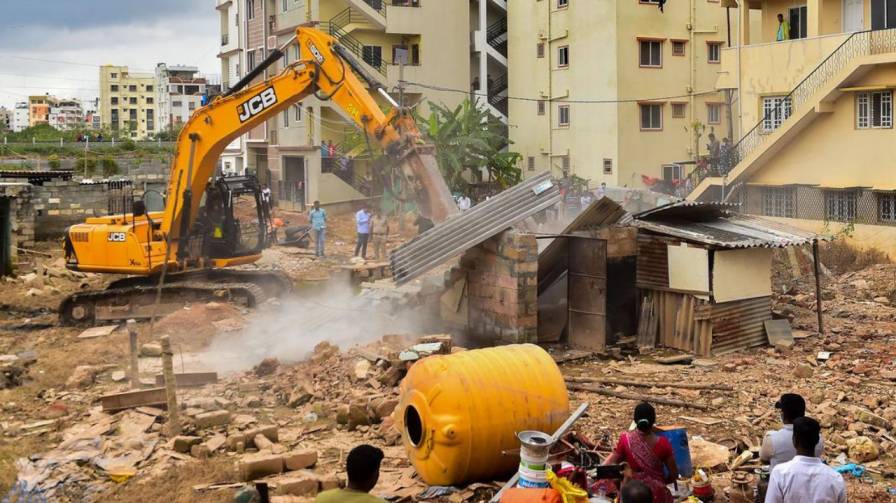 BBMP: Preparation for BBMP encroachment clearance operations; Bulldozer ...